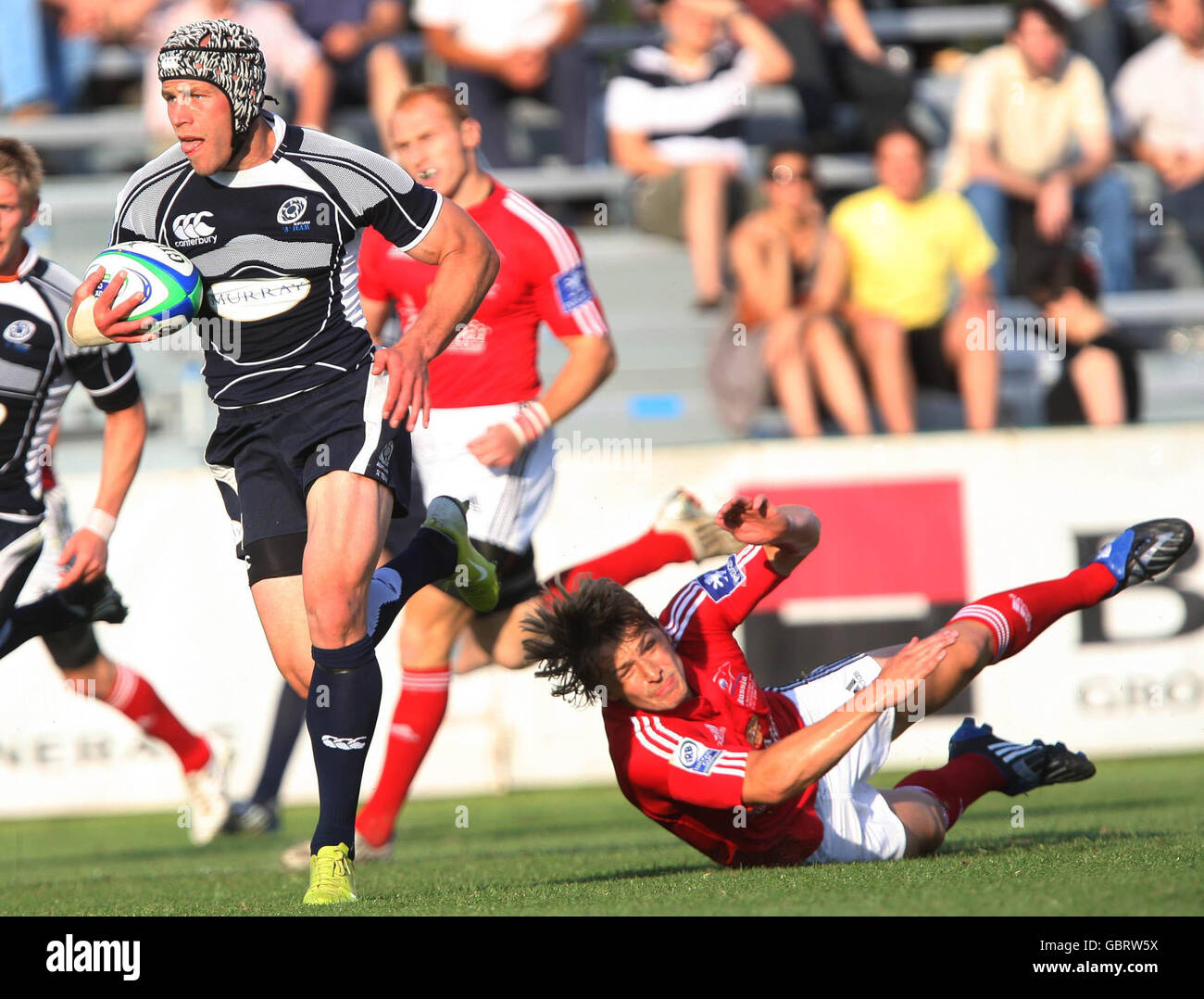 Scotland's Simon Webster (left) breaks through the Russian defence ...