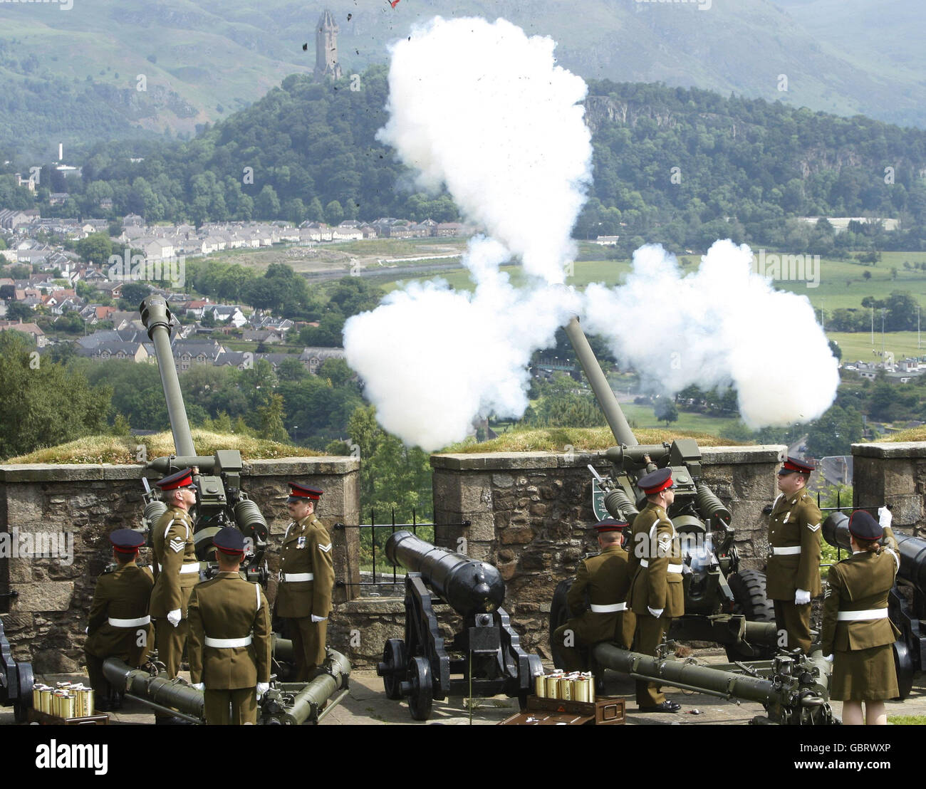 The gun battery fires during the Royal Gun salute to mark the Queen's ...