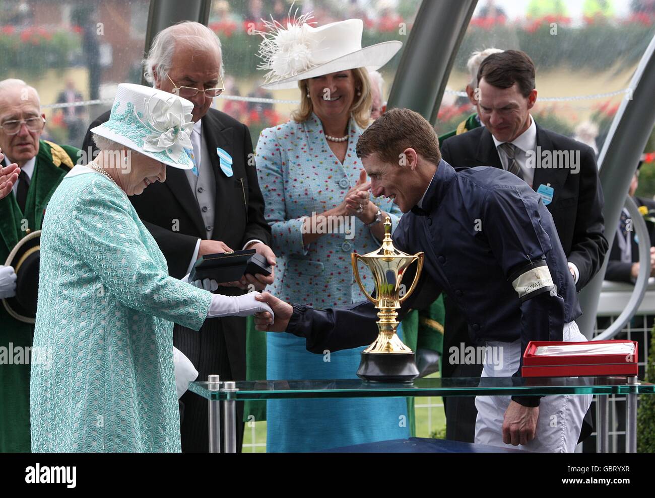 Queen Elizabeth II presents Johnny Murtagh with his winners medal after ...