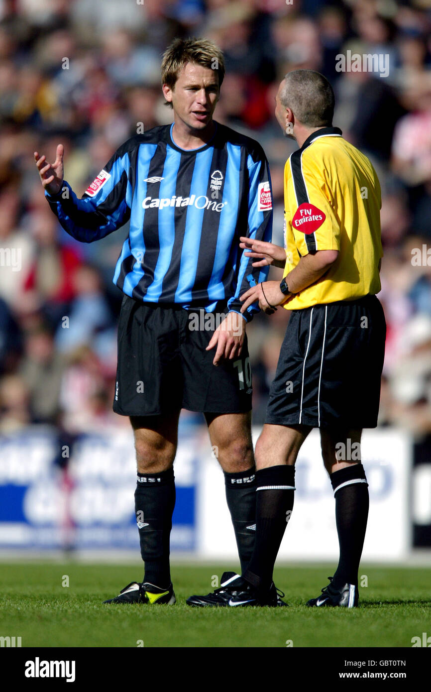 Referee Mike Thorpe has words with Nottingham Forest's Gareth Taylor (l ...