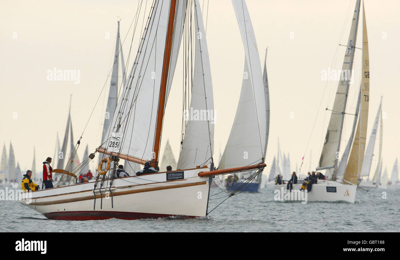 Polly Agatha, a Bristol Pilot Cutter (left), heads off the start line ...