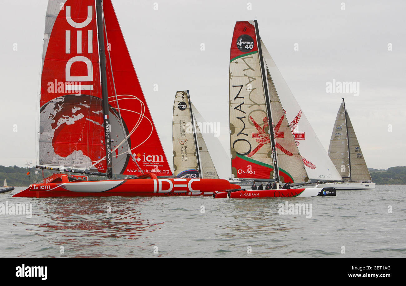 The Oman Sail extreme 40 catamaran (right) leaves the start during the ...
