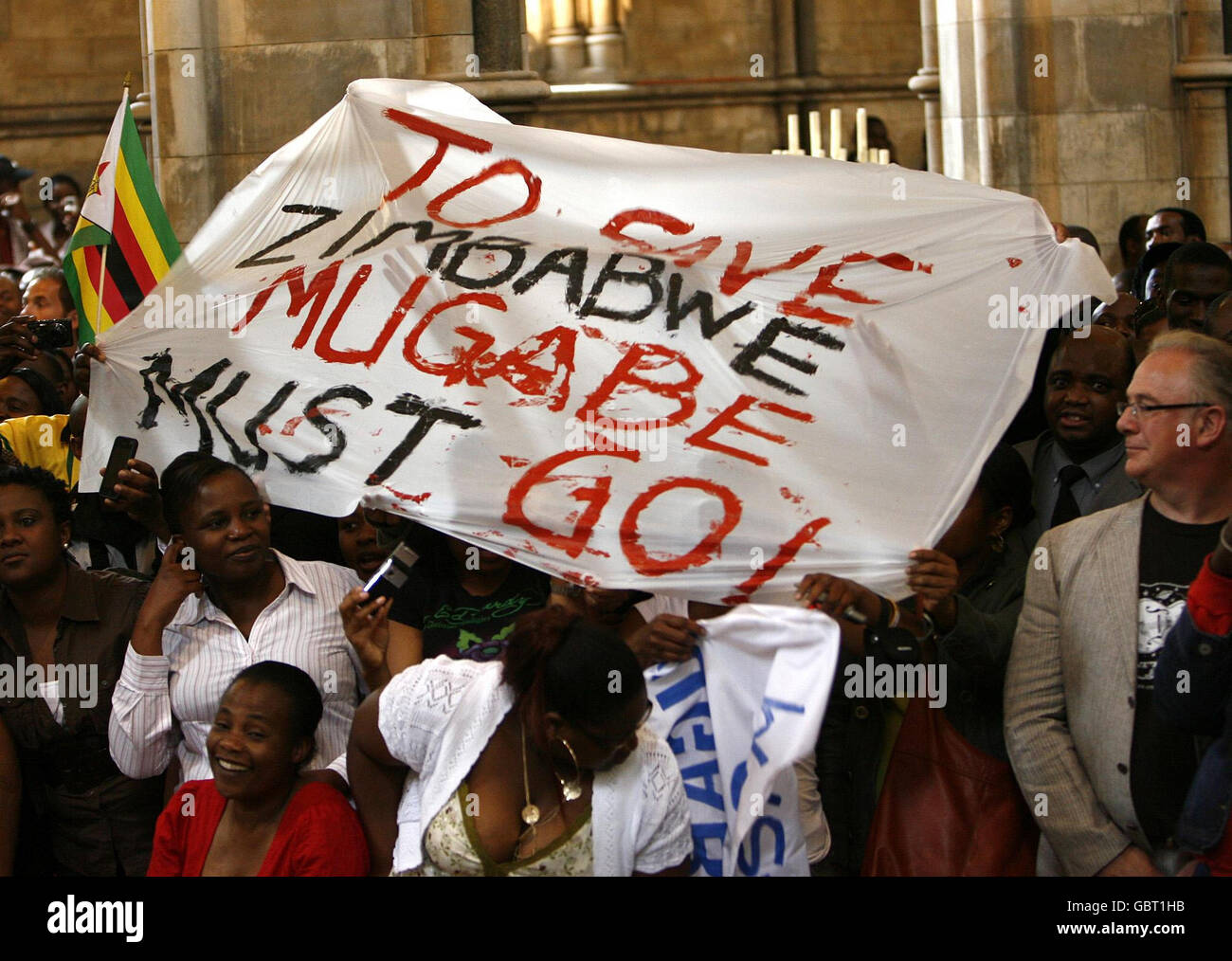 A poster accusing the current regime in Zimbabwe, reading "To save ...