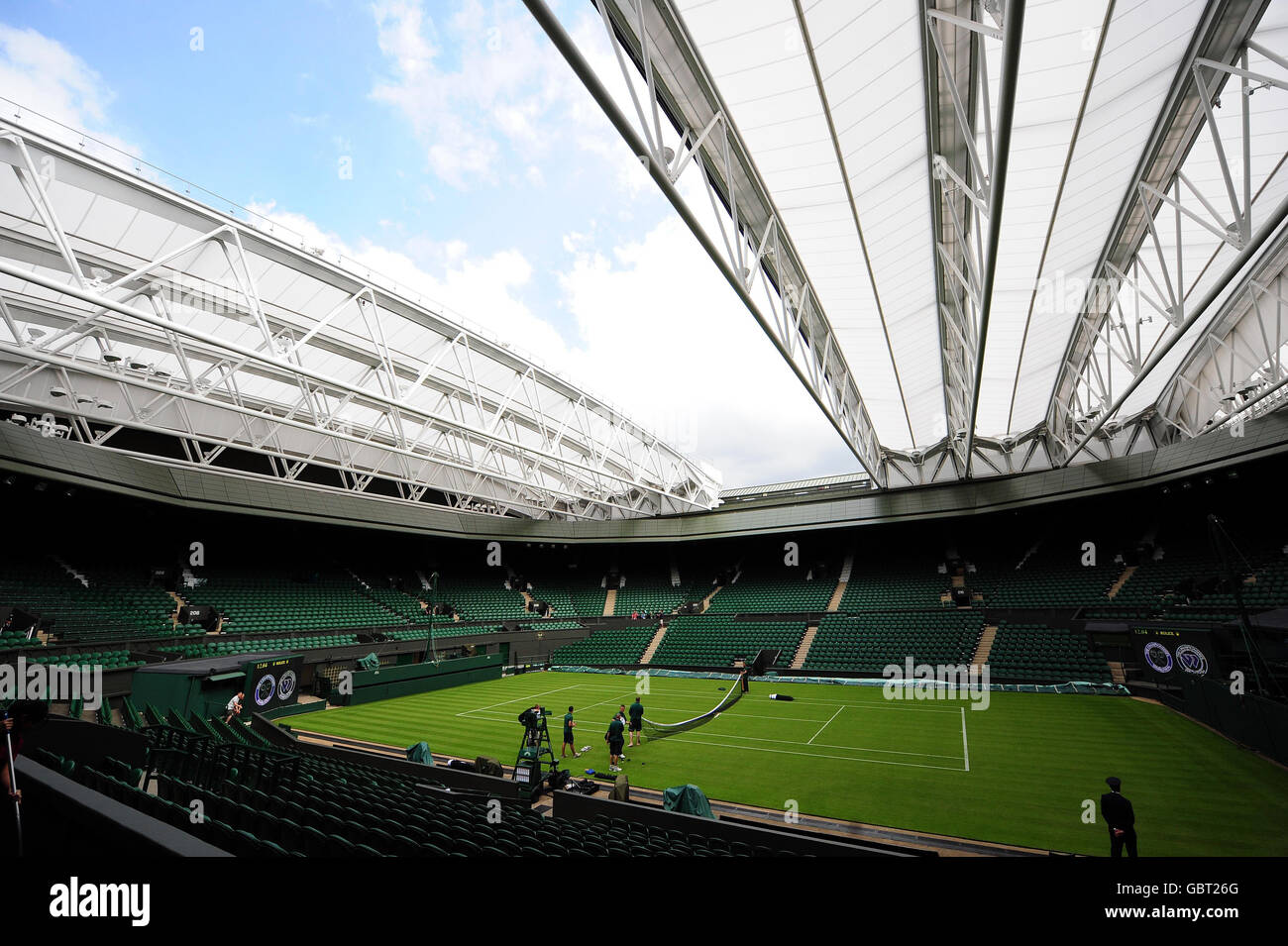 The roof is tested and nets put up on Centre Court at the All England ...