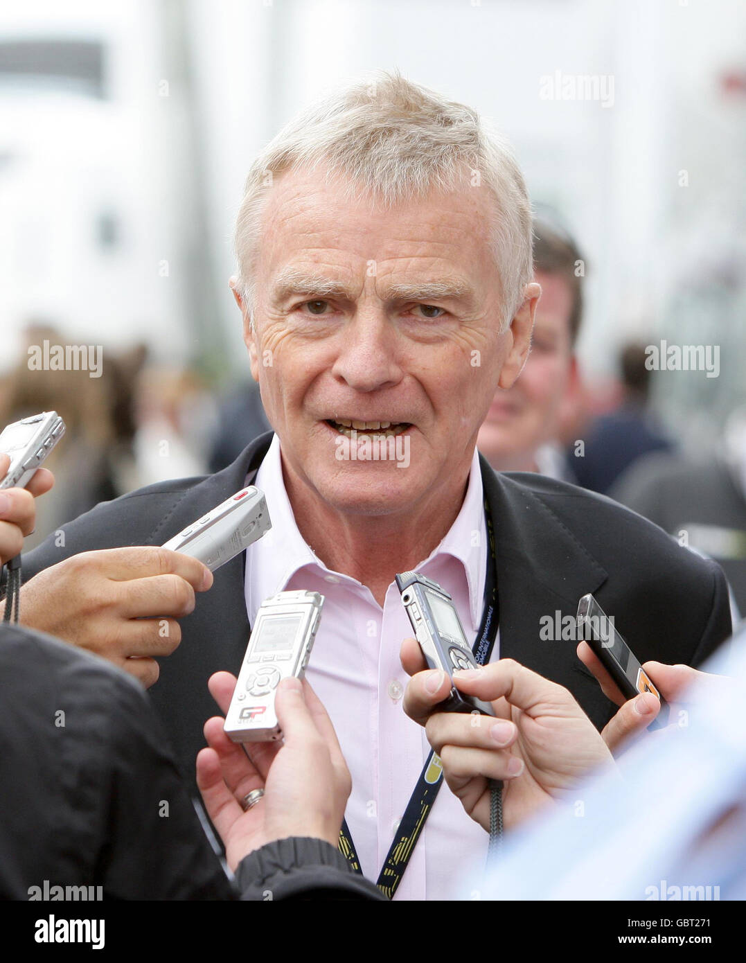FIA president Max Mosley in the paddock, hounded by the media before ...