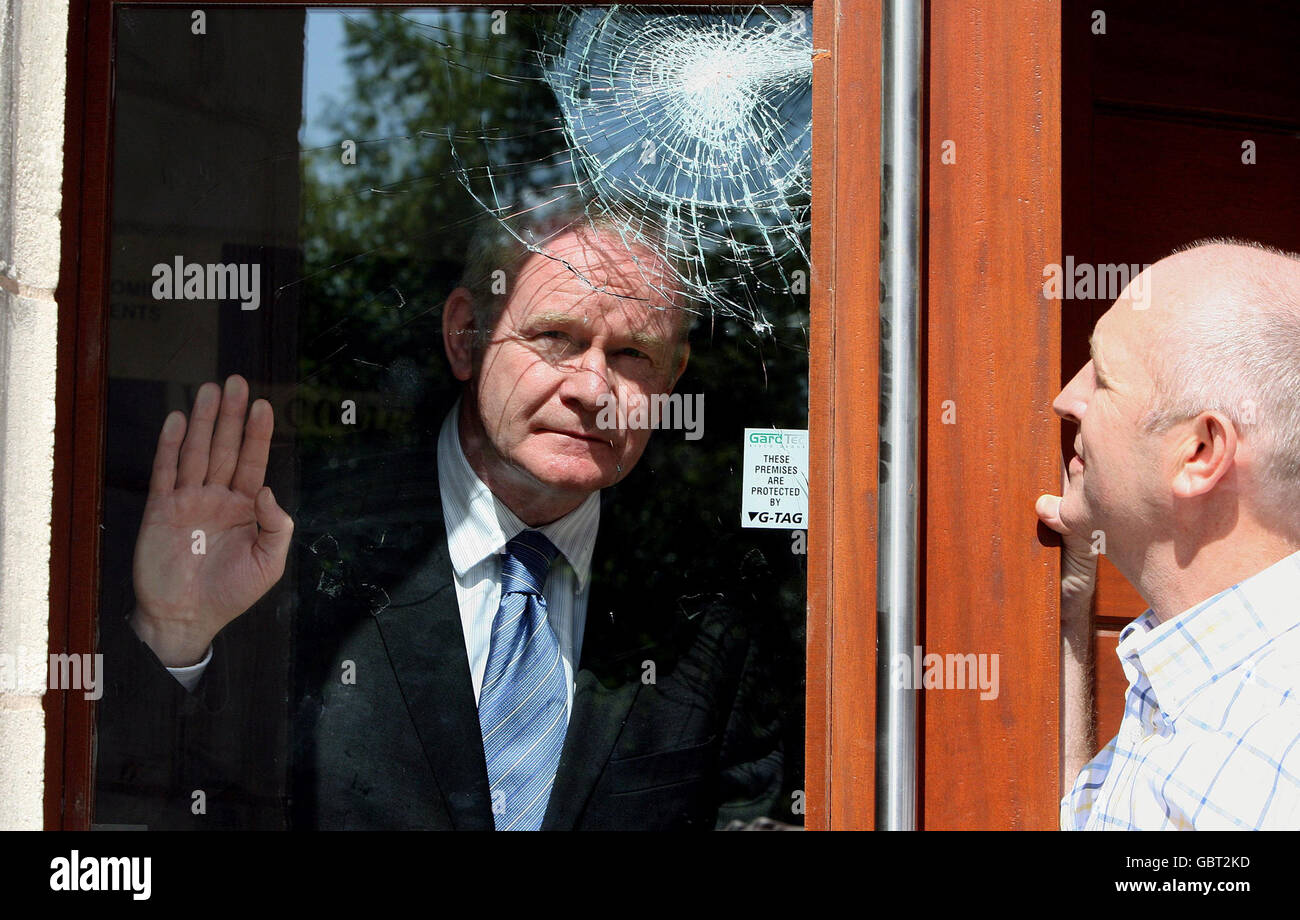 Deputy First Minister Martin McGuinness and Pastor Malcolm Morgan look ...