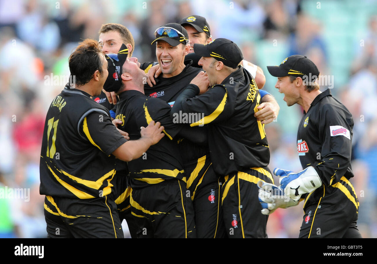Martin van Jaarsveld (centre) is congratulated by his Kent Spitfires ...
