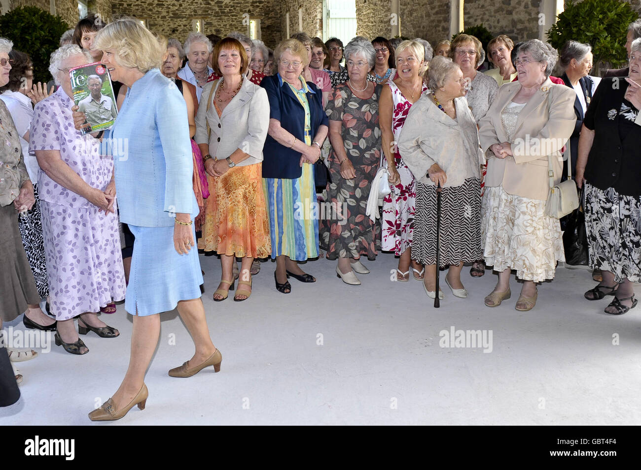 The Duchess of Cornwall, holding the WI Life magazine with her husband ...