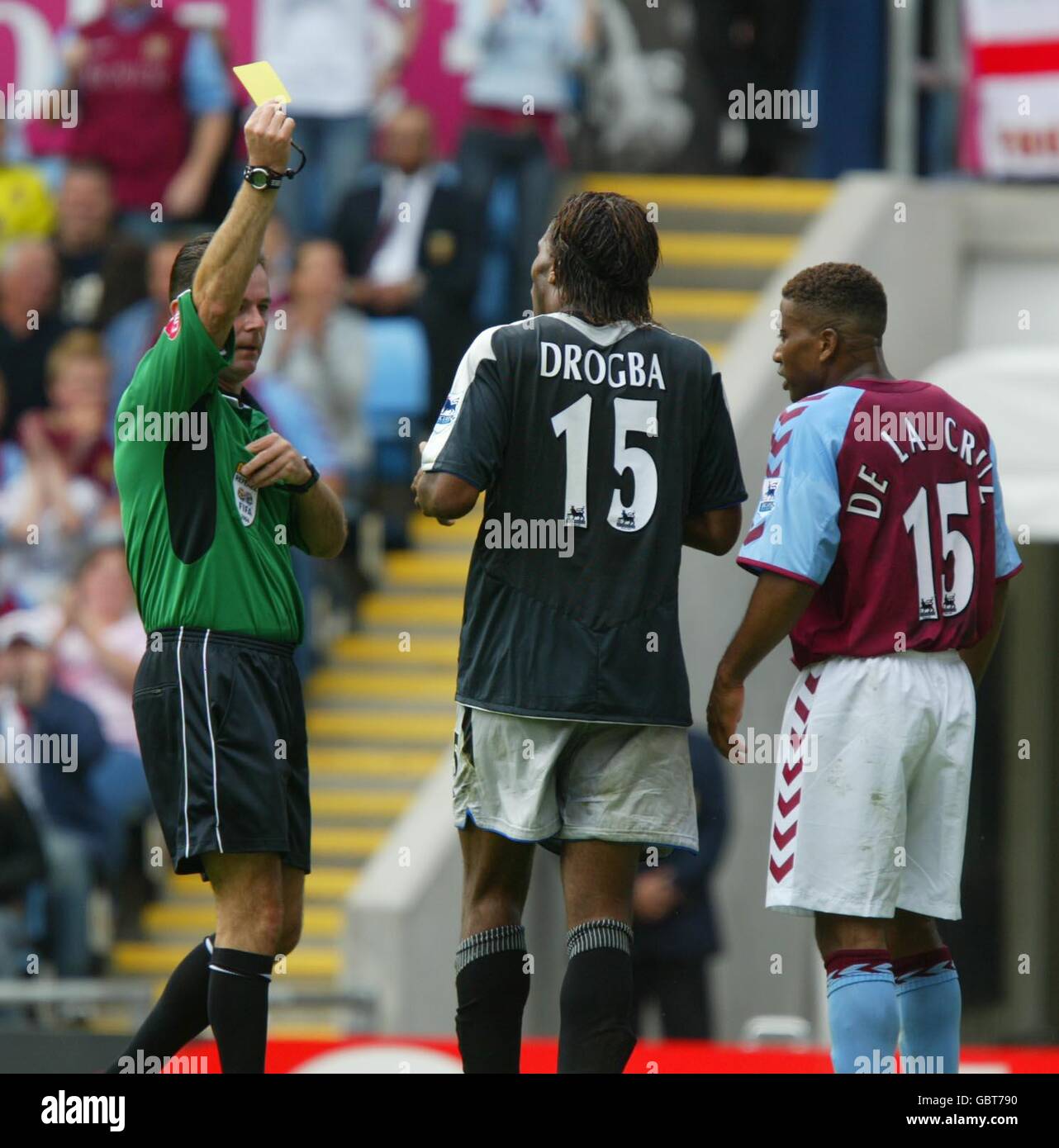 Chelsea's Didier Drogba (c) is booked by referee Rob Styles after ...