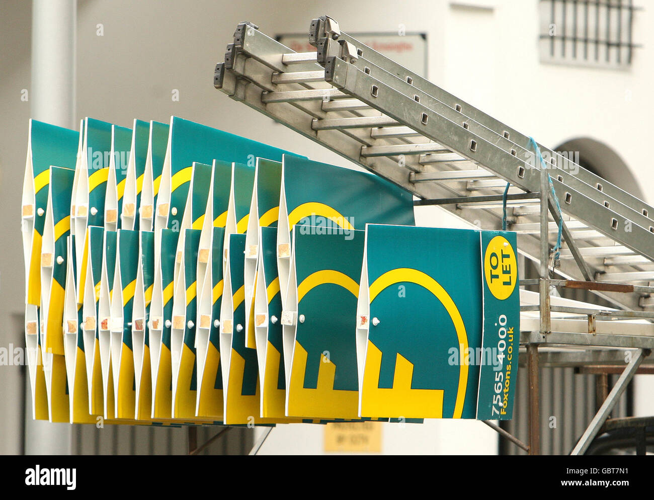 A lorry carrying estate agents signs, in Chelsea, west London Stock ...