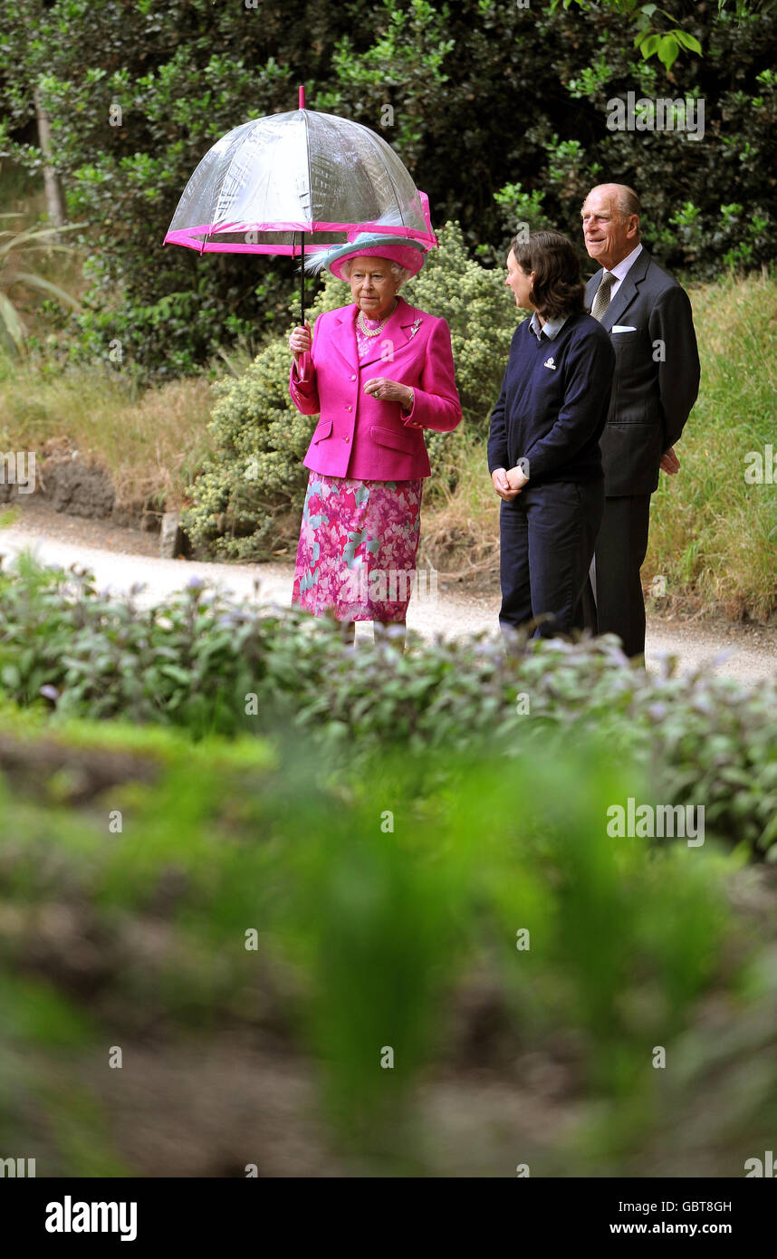 Britain's Queen Elizabeth II (left) and the Duke of Edinburgh talk to ...