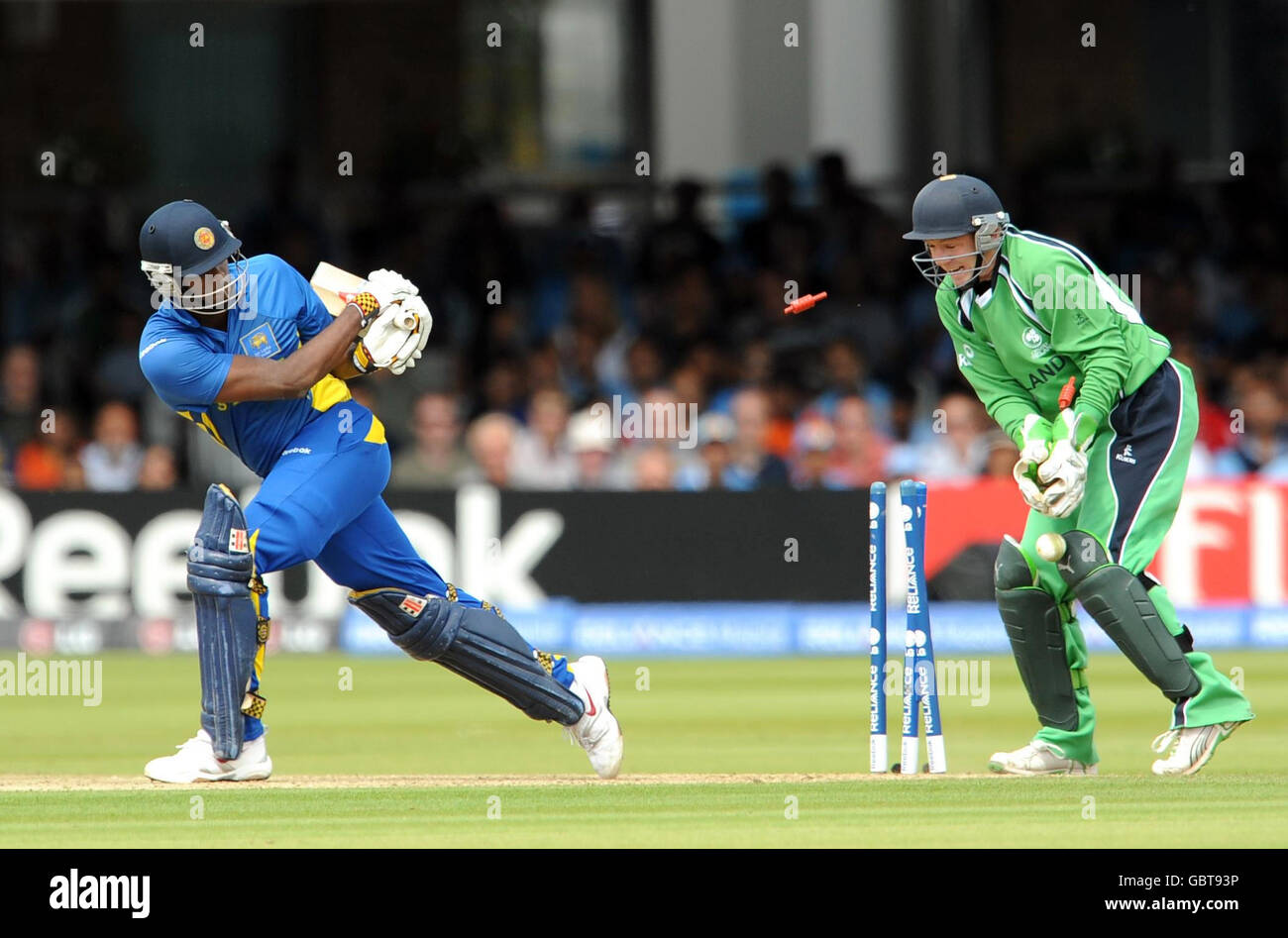 Sri Lanka's Angelo Mathews is bowled out by Ireland's Alex Cusack ...