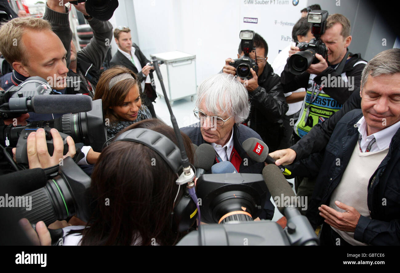 President and CEO of Formula One Bernie Ecclestone is swamped by the ...