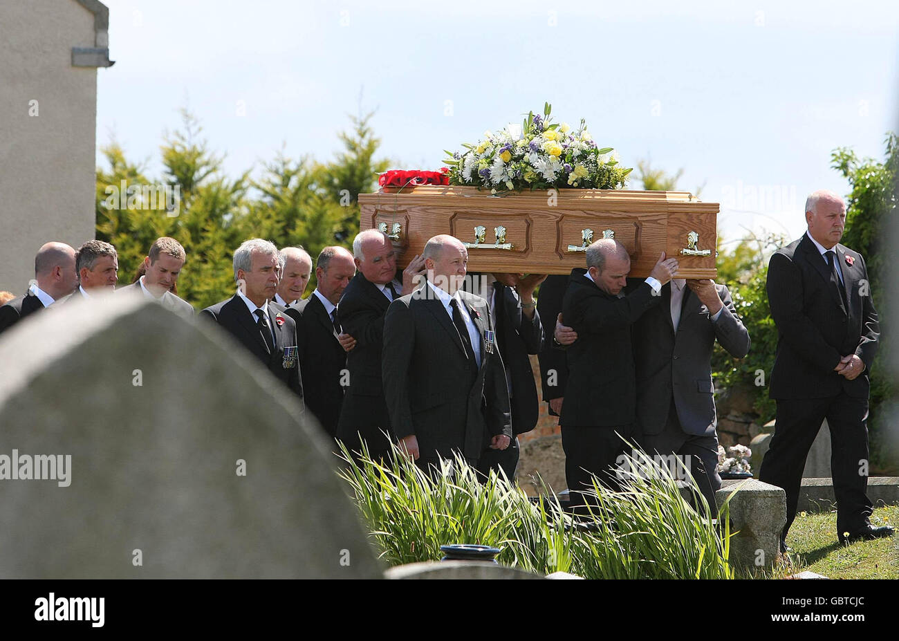 Mourners attend the funeral of Pilot and retired Police Officer Hugh ...