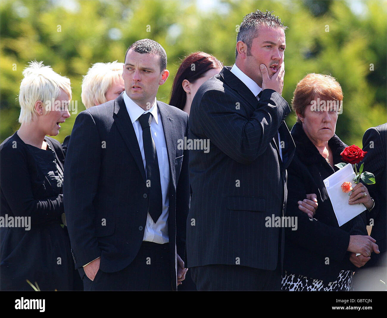 Mourners attend the funeral of Pilot and retired Police Officer Hugh ...