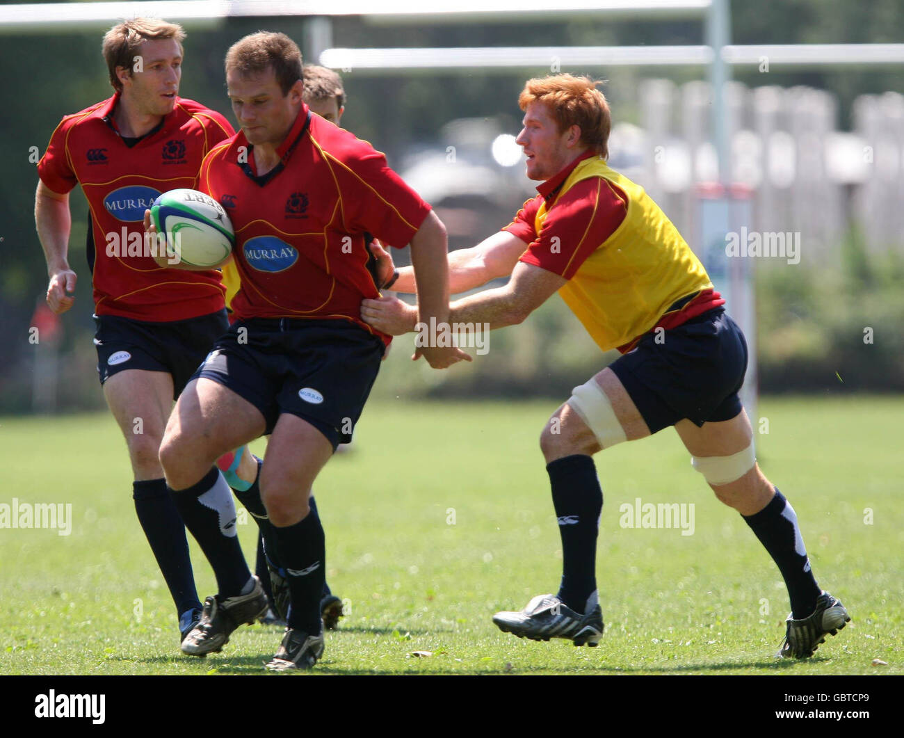 Scotland 'A's Jim Thompson looks on as Roddy Grant pulls back Geoff ...