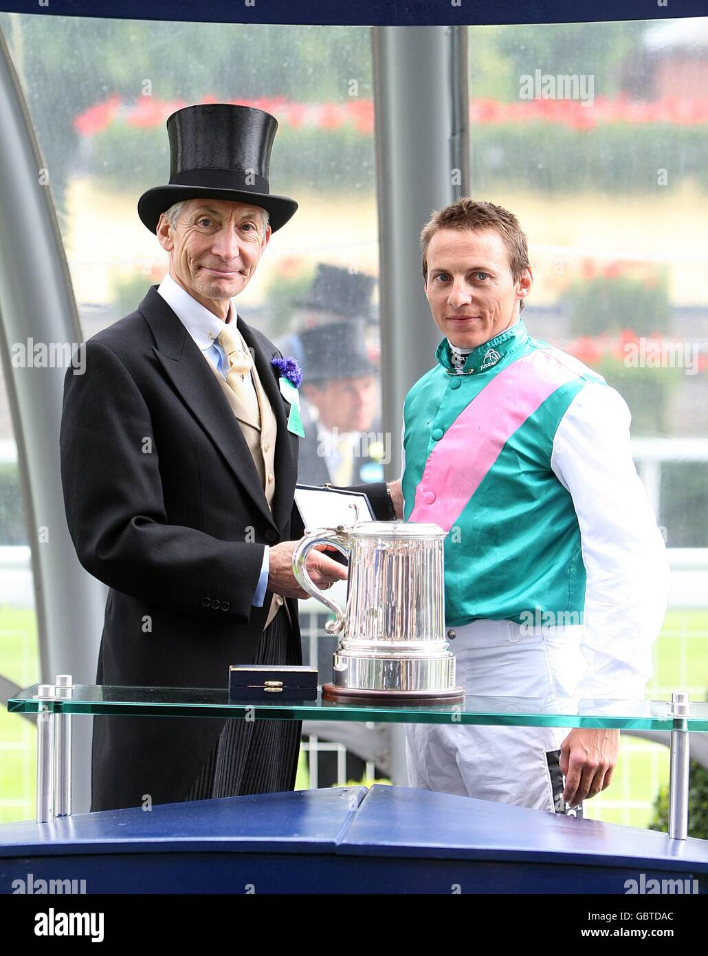Jockey Eddie Ahern with Charlie Watts after winning the King Edward VII ...