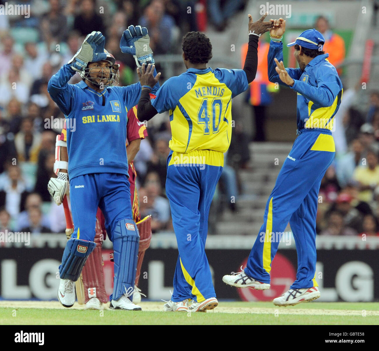 Sri Lanks'a Ajantha Mendis celebrates with captain Kumar Sangakkara as ...