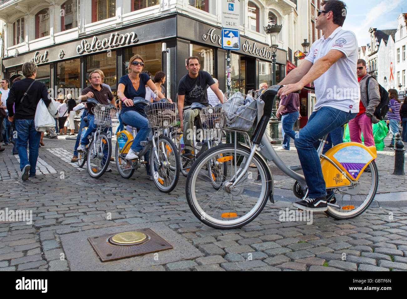 group tourists villo bicycles bikes cycle brussels Stock Photo - Alamy