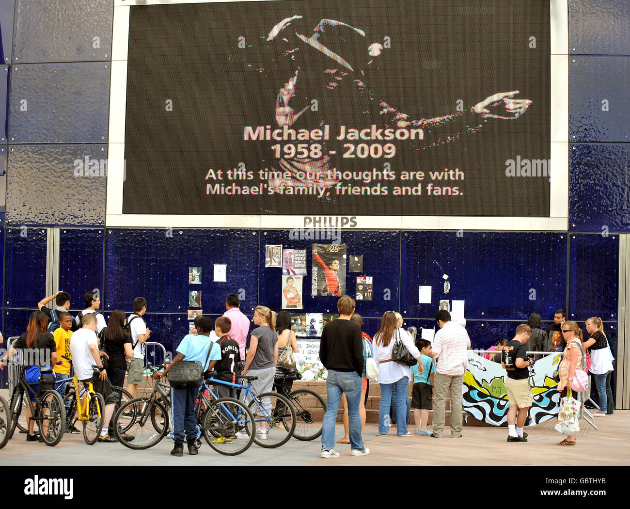 A group of Michael Jackson fans stand at a shrine to the American ...