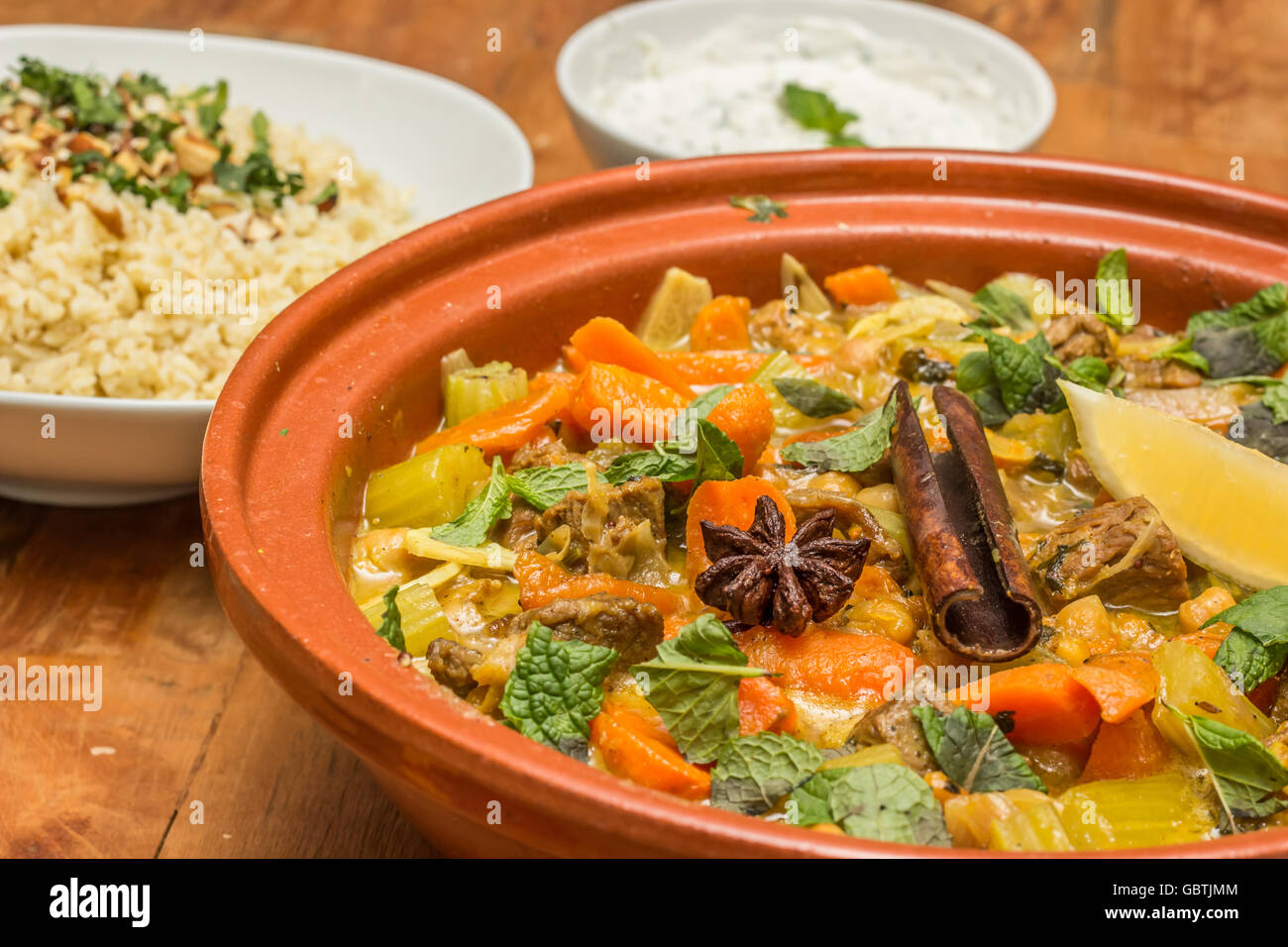 Moroccan tagine dish with chick peas, lamb, carrots, celery, lemon ...