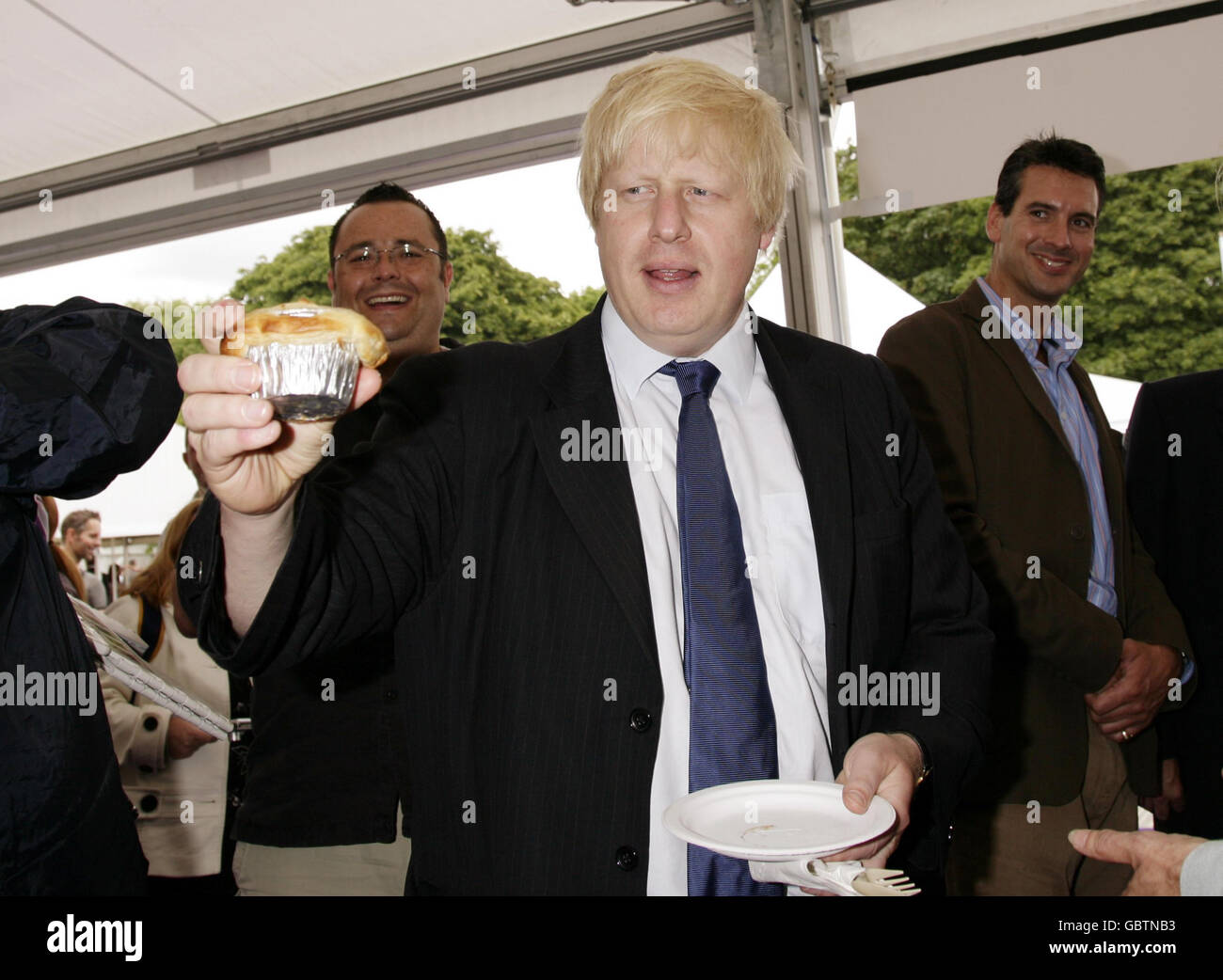 Mayor of London Boris Johnson sampling a pie at a food stall, during ...