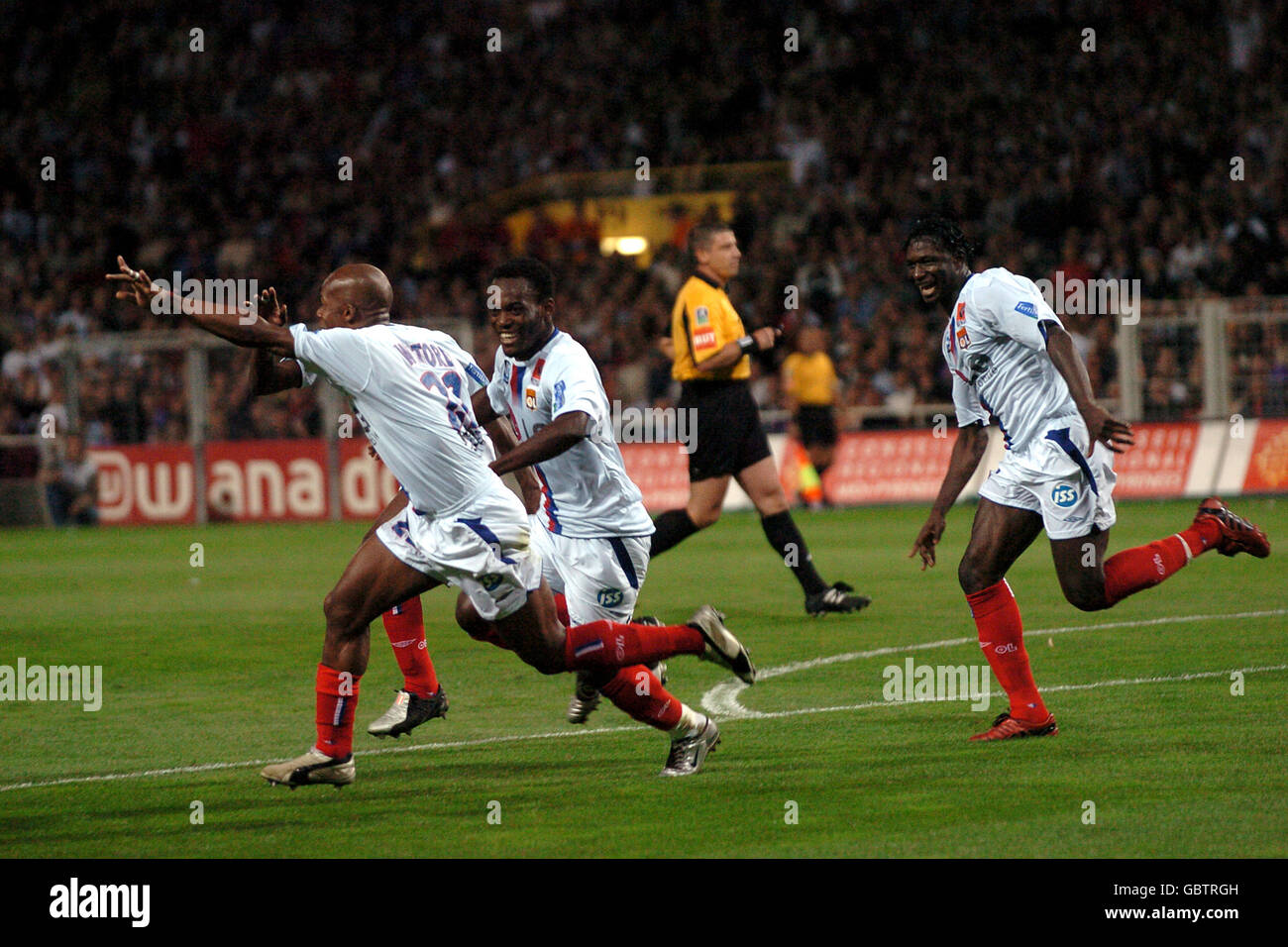 Olympique Lyonnais' Michael Essien (c) celebrates scoring their opening ...