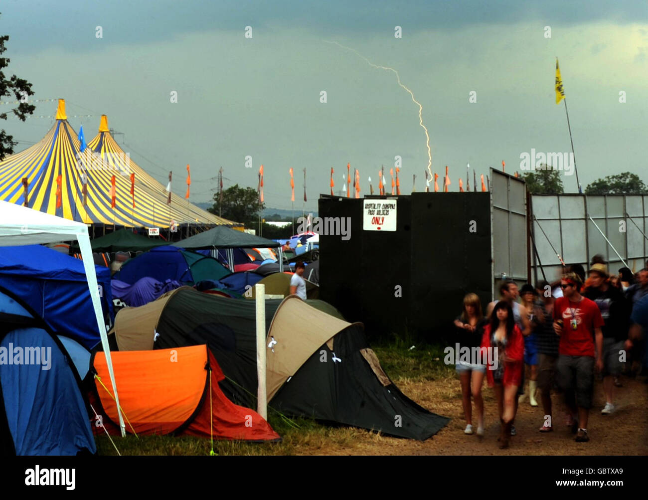 Lightning flashes above the 2009 Glastonbury Festival taking place at ...