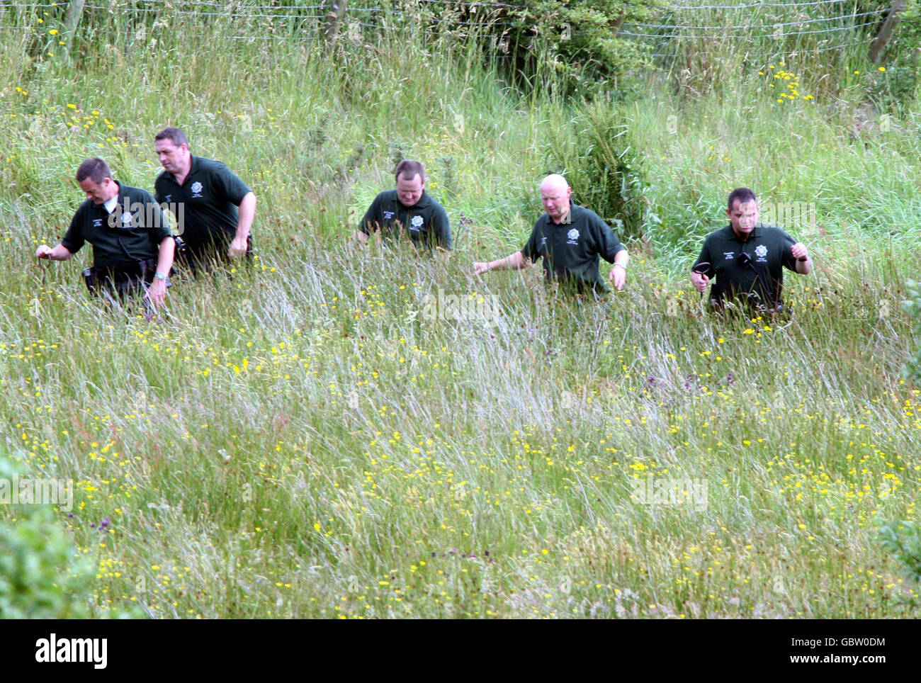 Police search land in double murder probe Stock Photo - Alamy