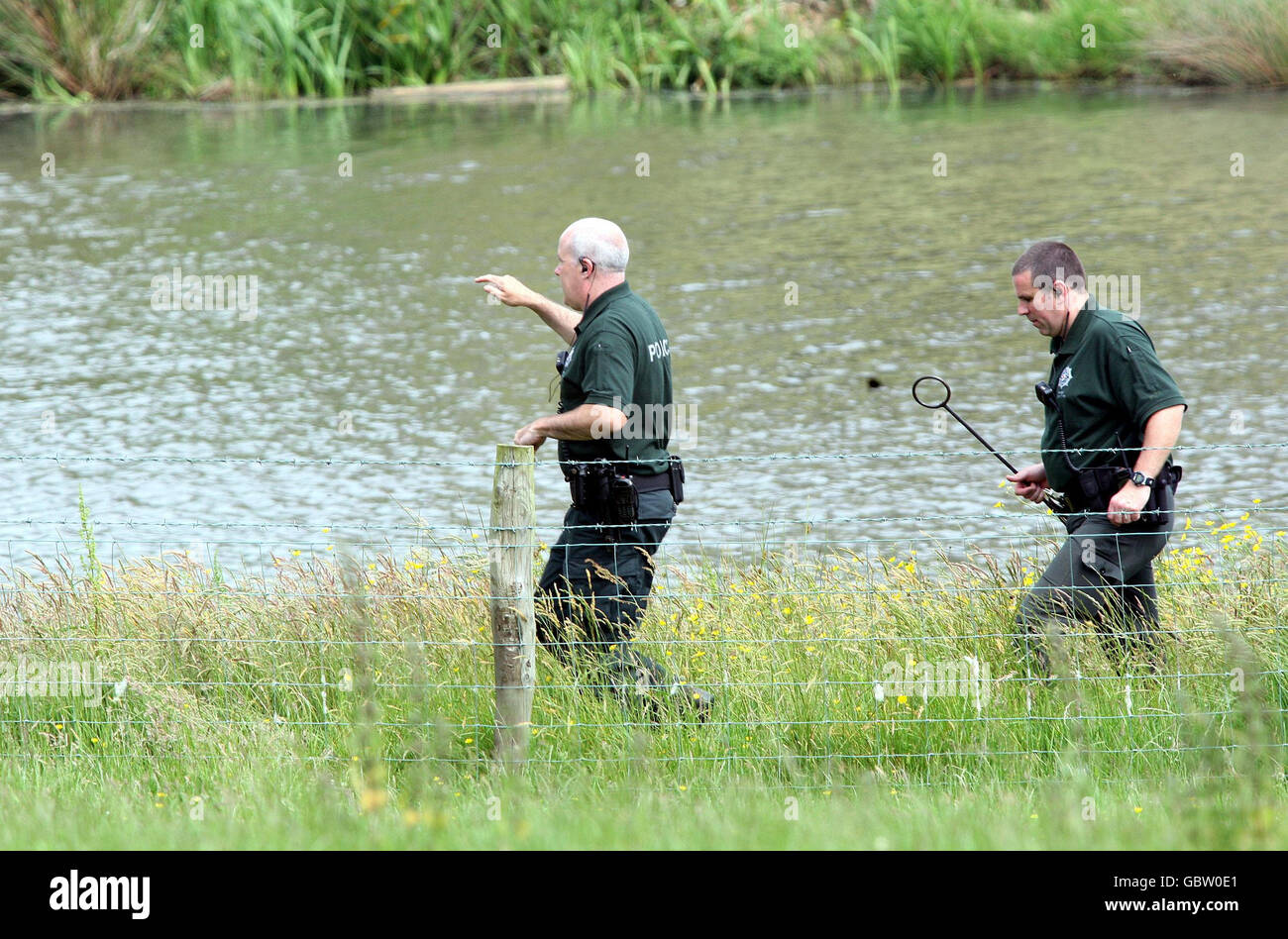 Police search land in double murder probe Stock Photo - Alamy