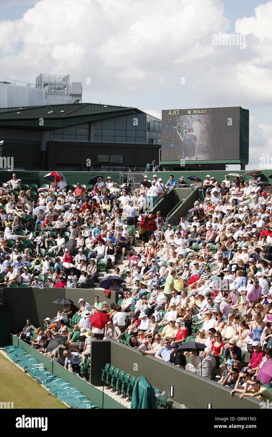 Spectators at Court Two watch Andy Murray in action on big screens ...