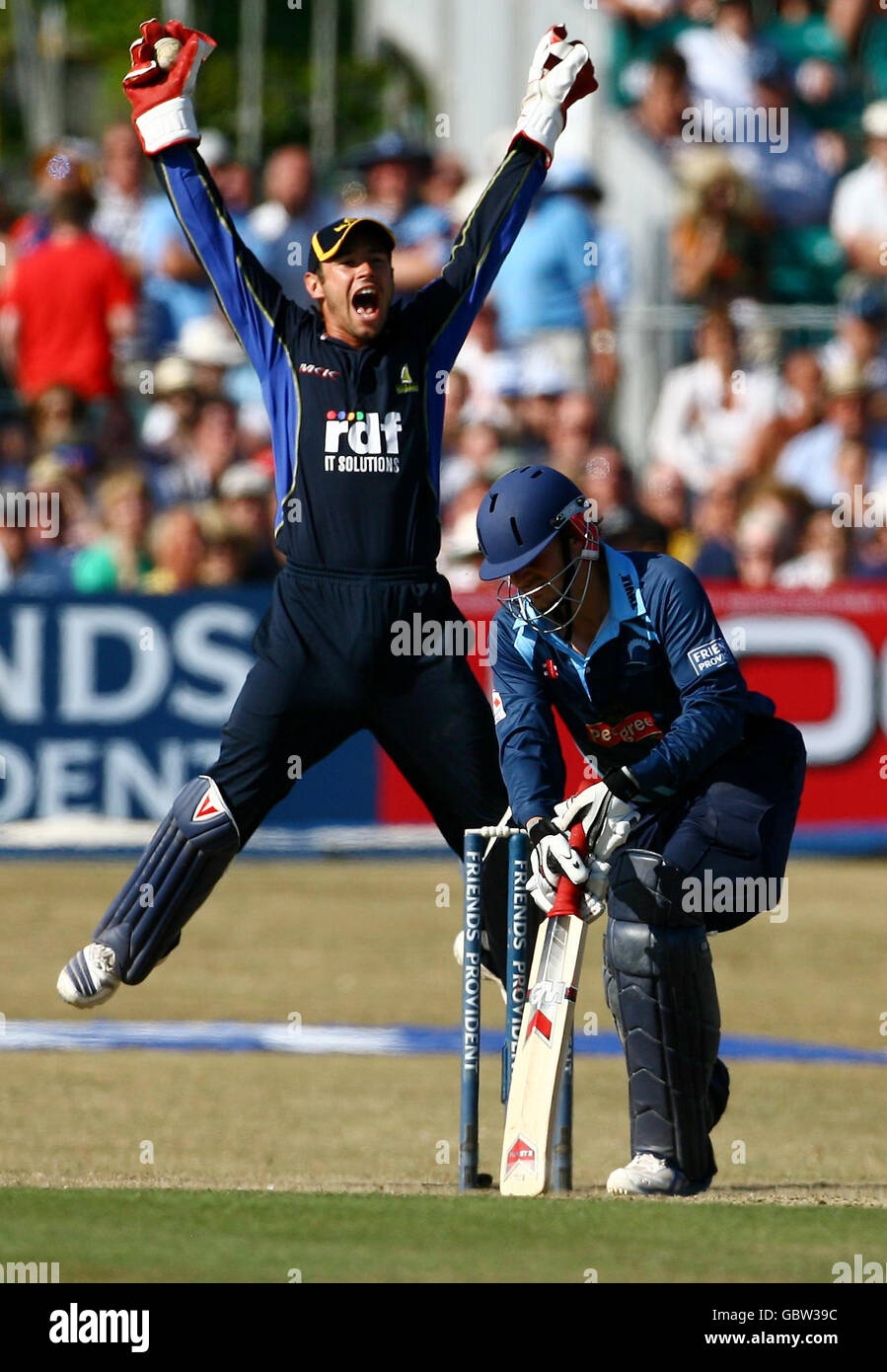 Gloucestershire's Alex Gidman loses his wicket as wicket-keeper Andy ...