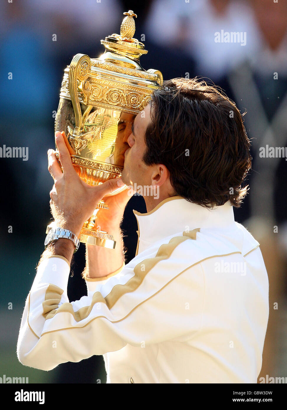 Switzerland's Roger Federer receives the trophy after beating USA's ...