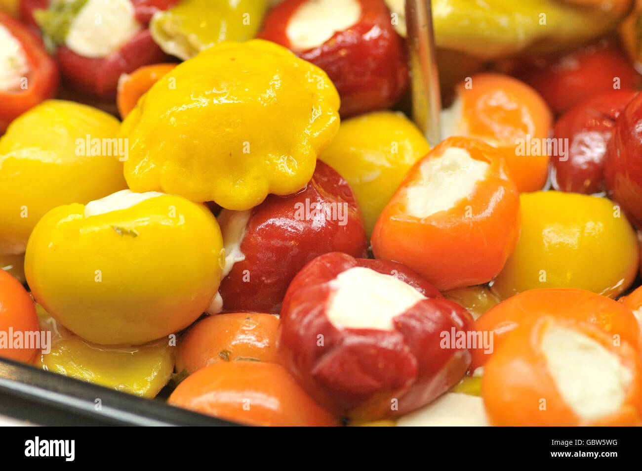Feta cheese-filled peppers in La Boqueria market, Barcelona. Catalonia ...
