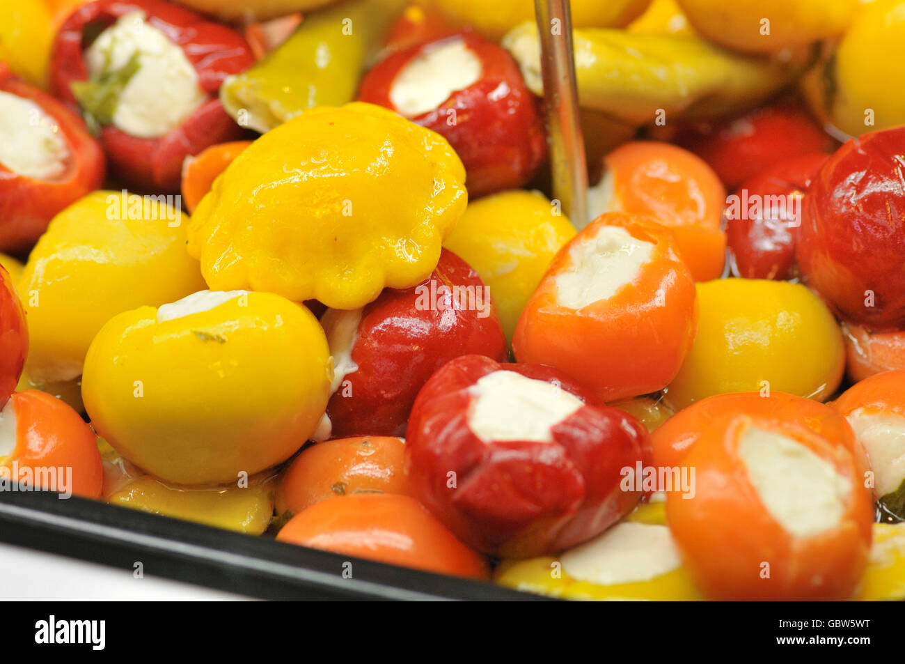 Feta cheese-filled peppers in La Boqueria market, Barcelona. Catalonia ...