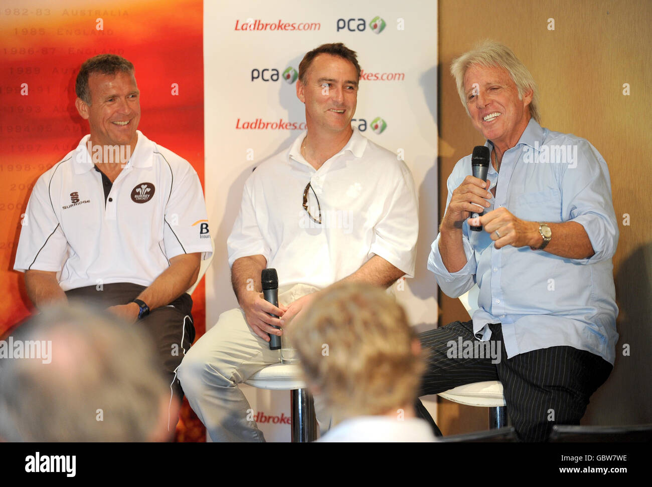 Alec Stewart (left) and Graham Thorpe (centre) look on as Jeff Thomson ...