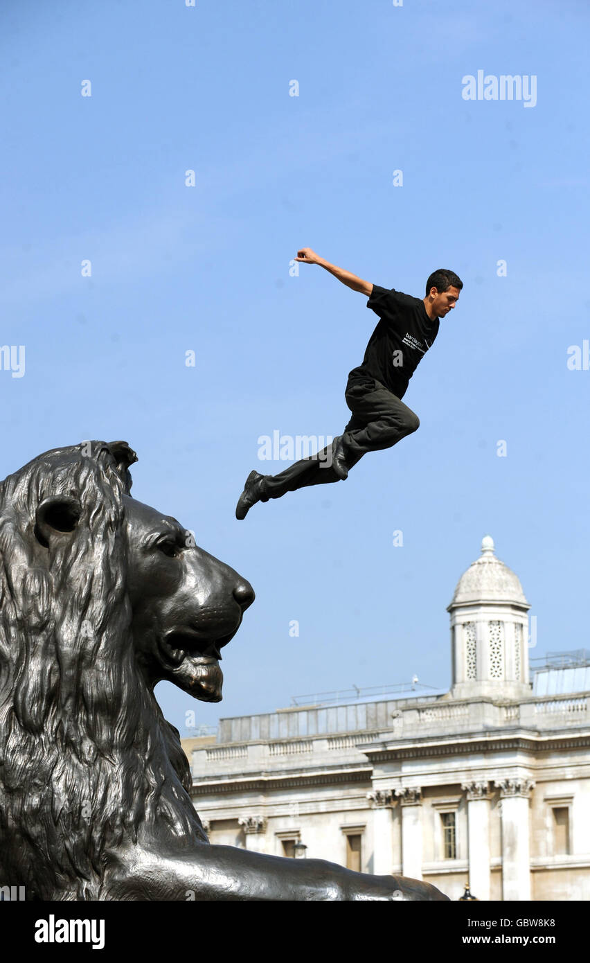 A freerunner demonstrate his skills in Trafalgar Square, London, at the ...