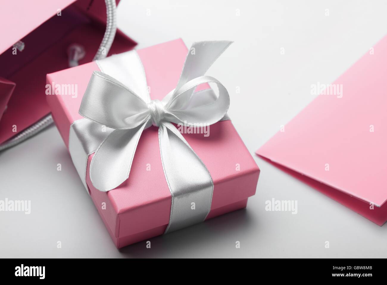 Luxury box tied with a white ribbon Stock Photo - Alamy