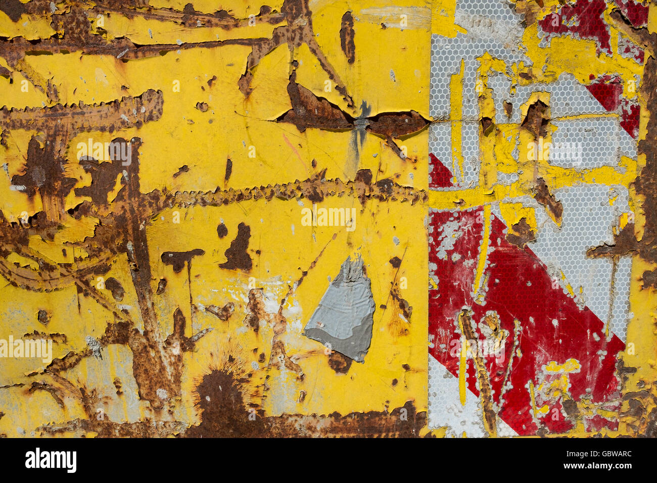 Yellow steel with rust and red and scratched white reflector Stock ...