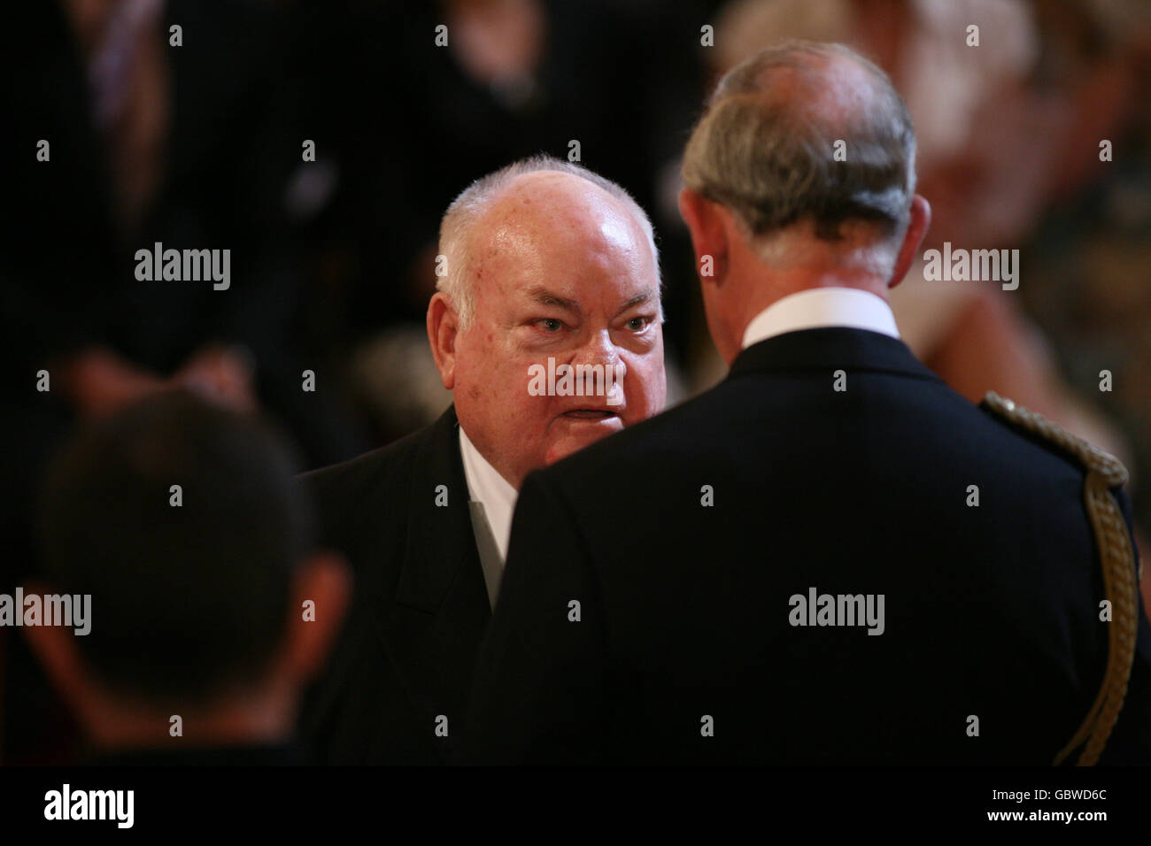 Mr. Gavin Crosbie is made an OBE by the Prince of Wales at Buckingham ...