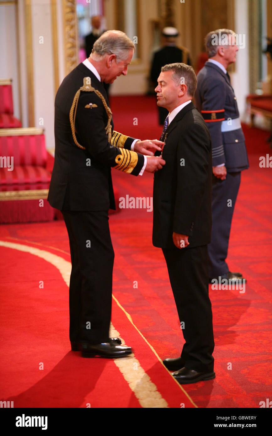 Commander David Acland is made an OBE by the Prince of Wales at ...