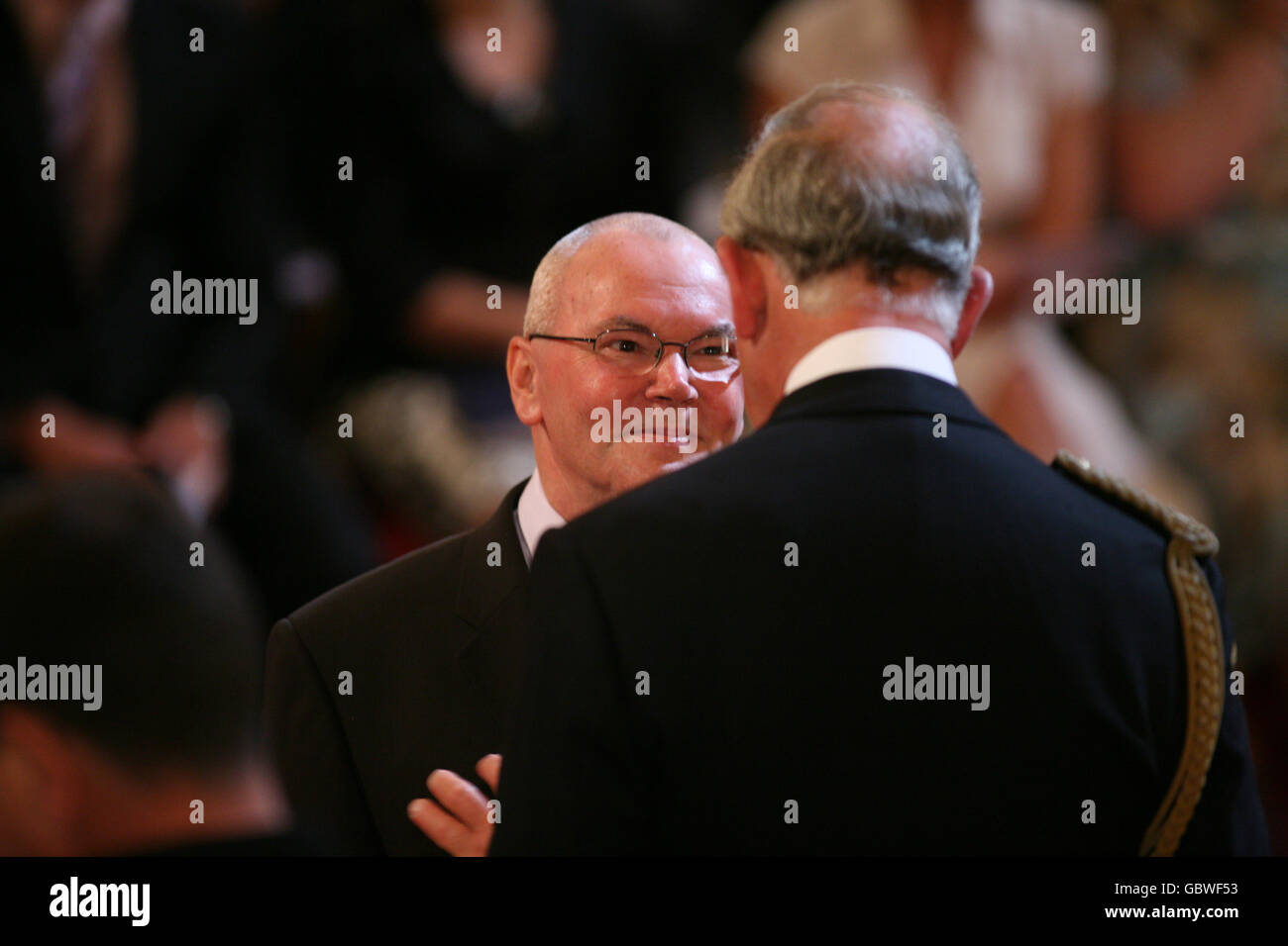 Dr. Stephen Davis from London is made an OBE by the Prince of Wales at ...