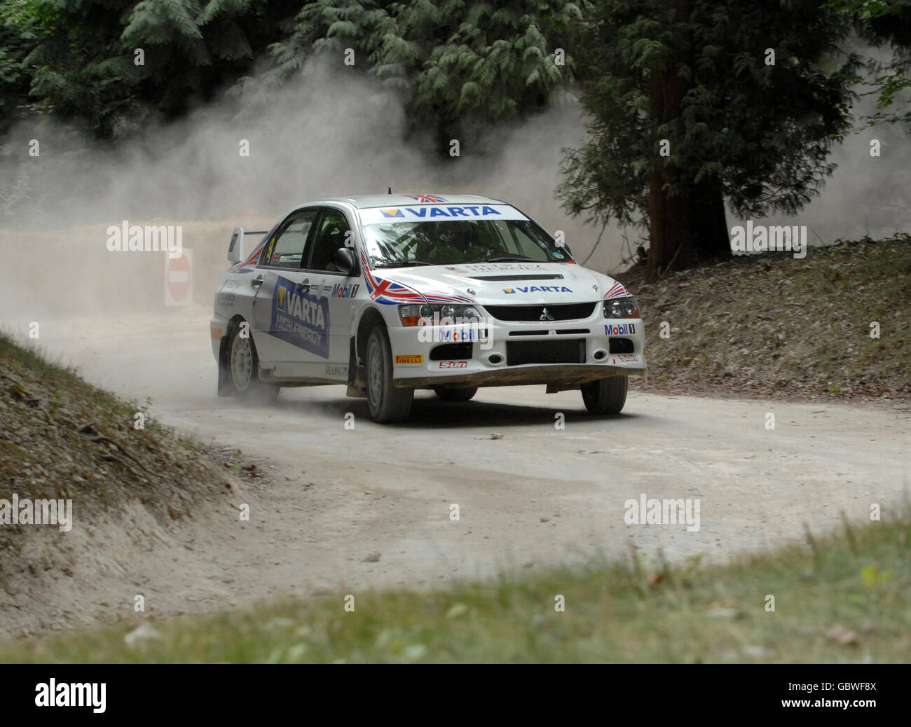 A Mitsubishi Lancer Evo IX is driven around the Forest Rally Stage ...