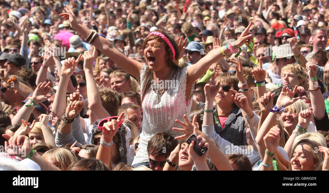 Revellers watch Calvin Harris perform on the Main Stage at the T in the ...