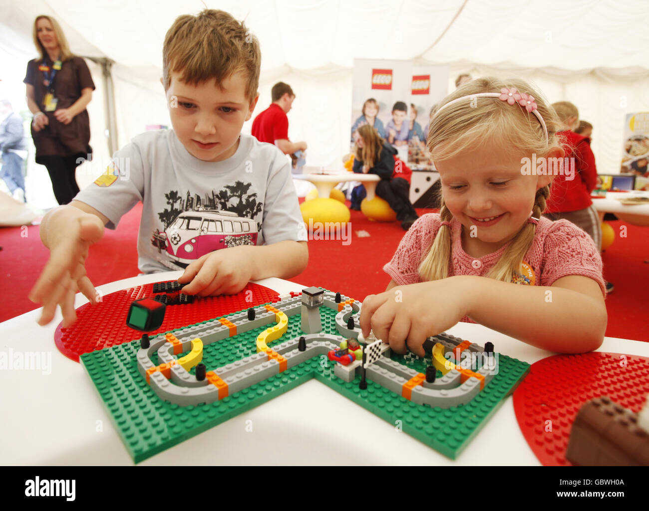 L-R Billy Johnson 6 and Cacey Austin 5, play with Race 3000 one of the ...
