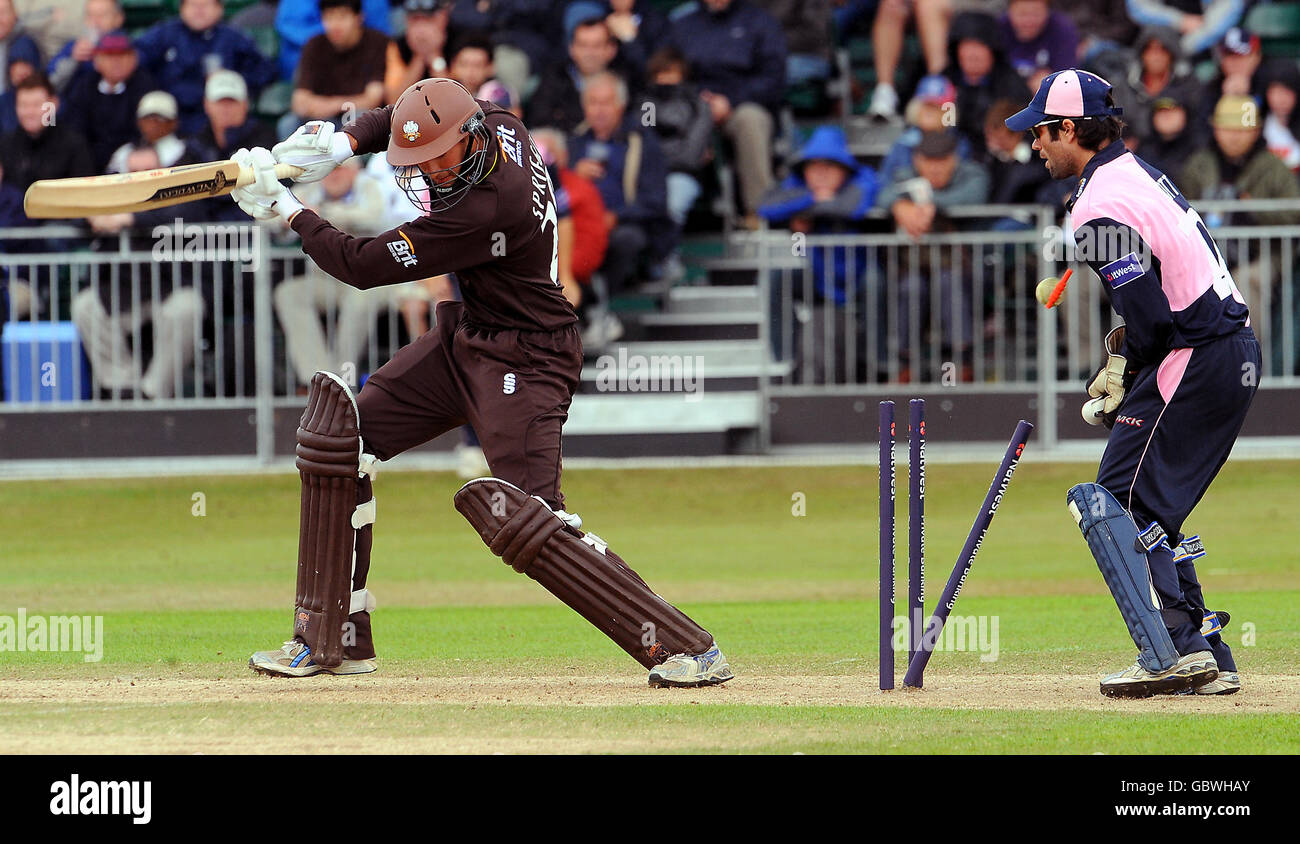 Surrey's Matthew Spriegel is bowled by Middlesex's Shaun Udal (out of ...