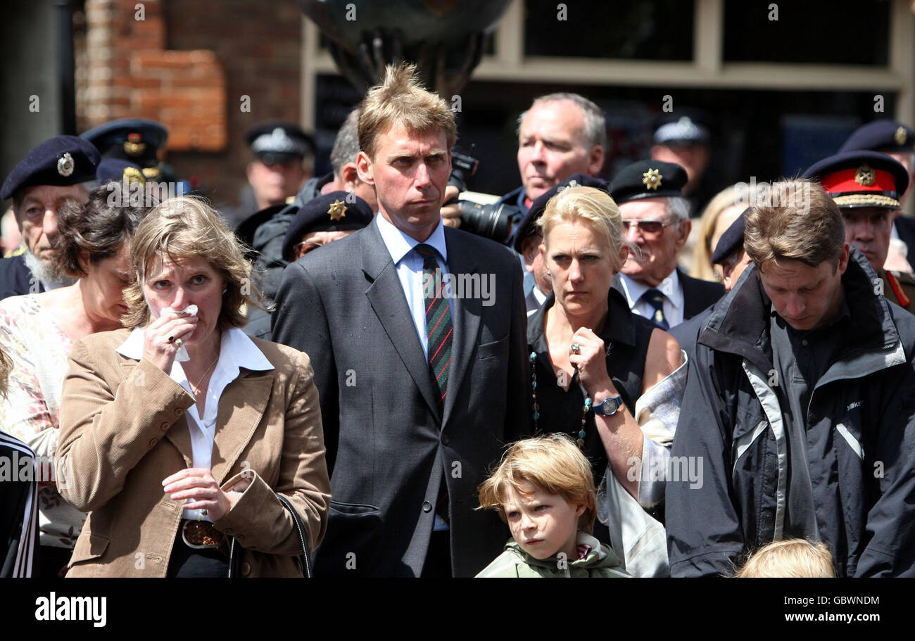 Unidentified mourners react as the coffins of Trooper Joshua Hammond 18 ...