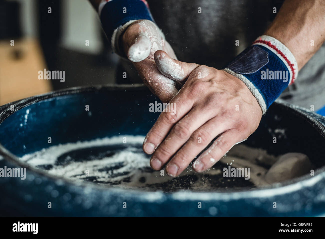 Man prepares for crossfit workout and chalk his hands before ...