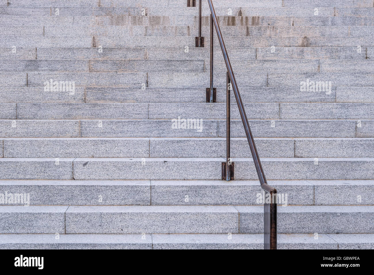 Many granite steps and handrail. Front view Stock Photo - Alamy