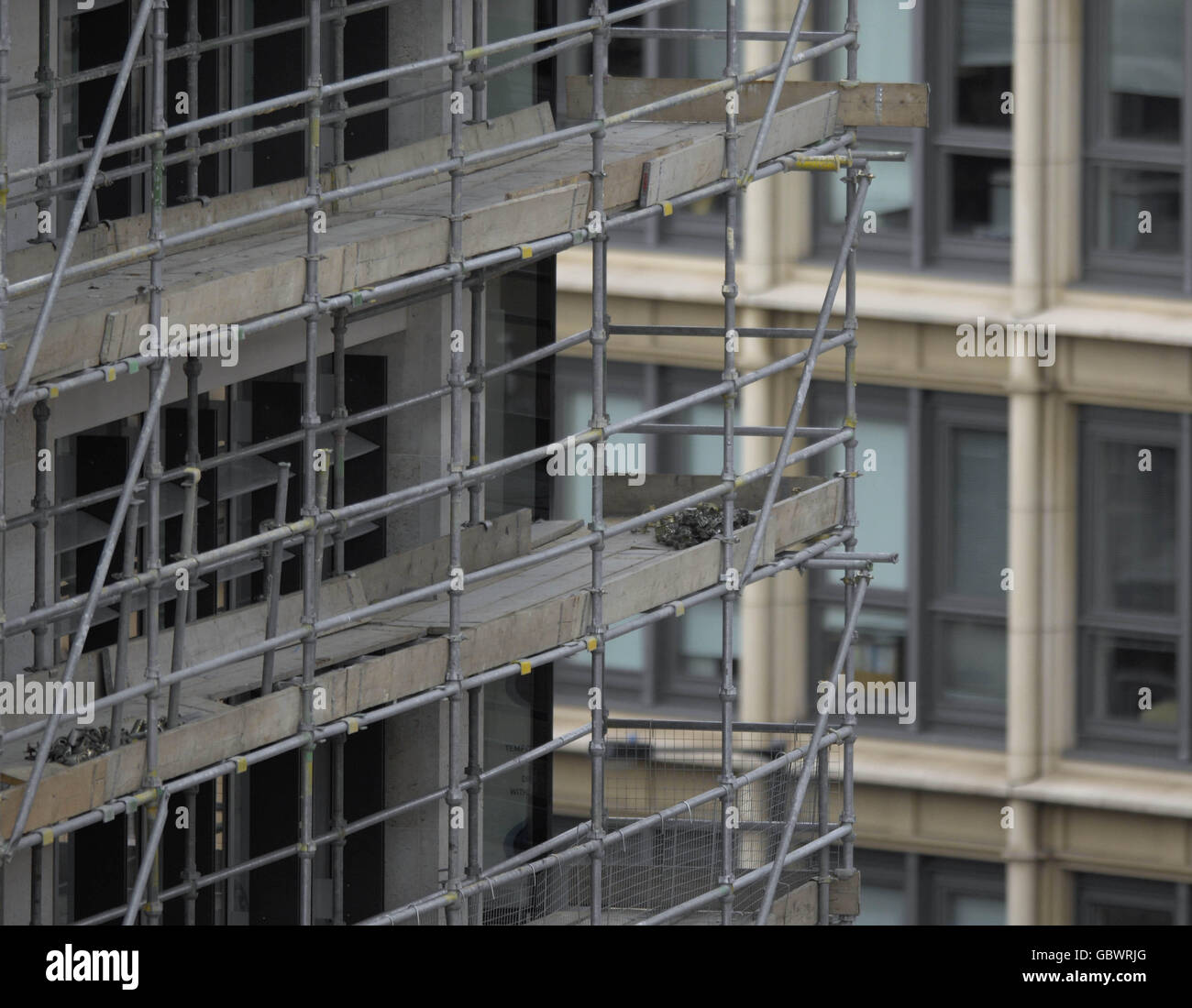 Scaffolding on the outside of a newly built office block in central ...